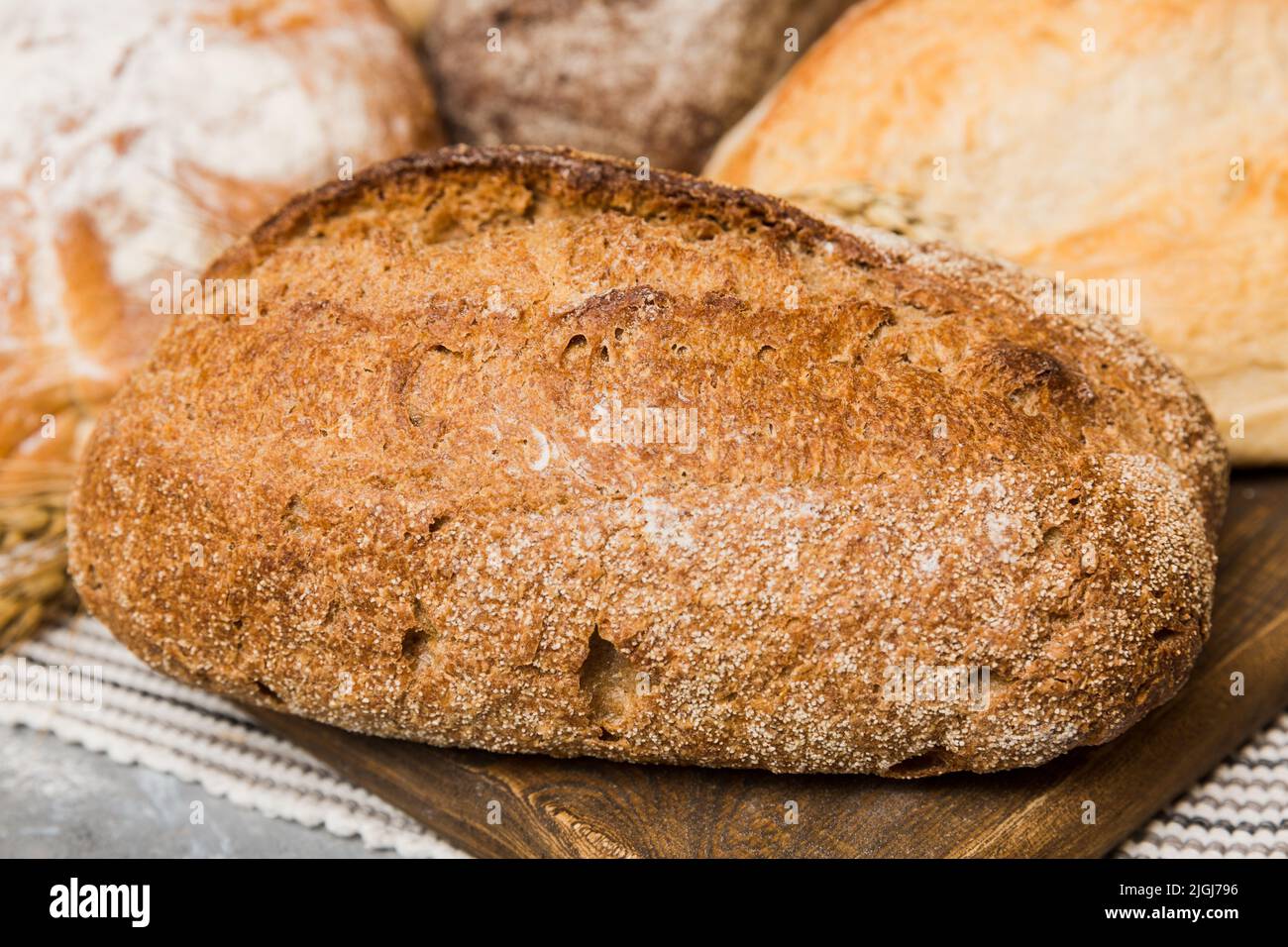 Homemade natural breads. Different kinds of fresh bread as background ...