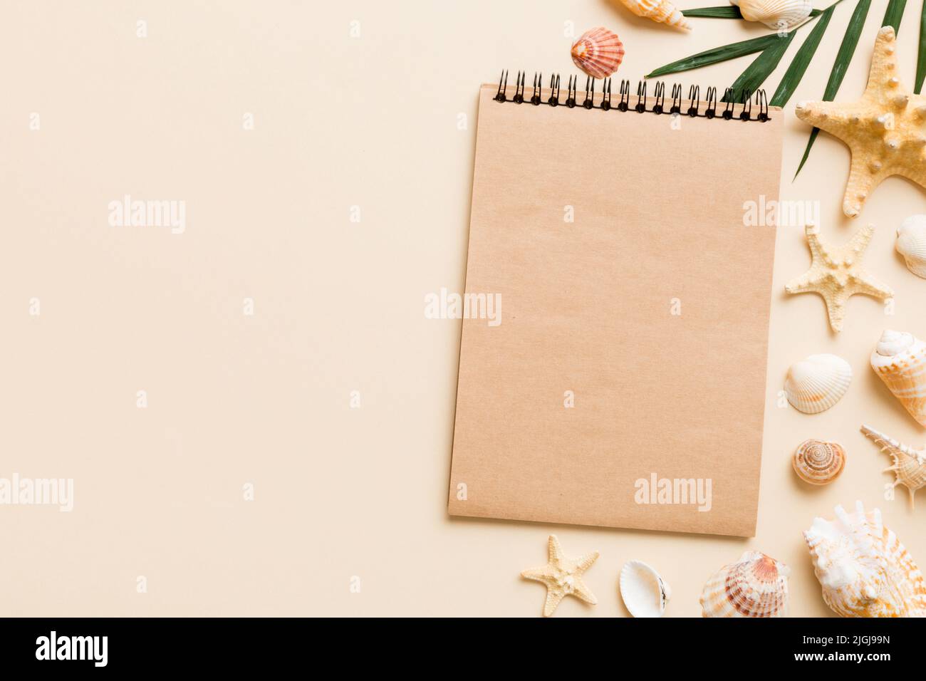 Blank writing book with summer beach accessories on background, copy ...