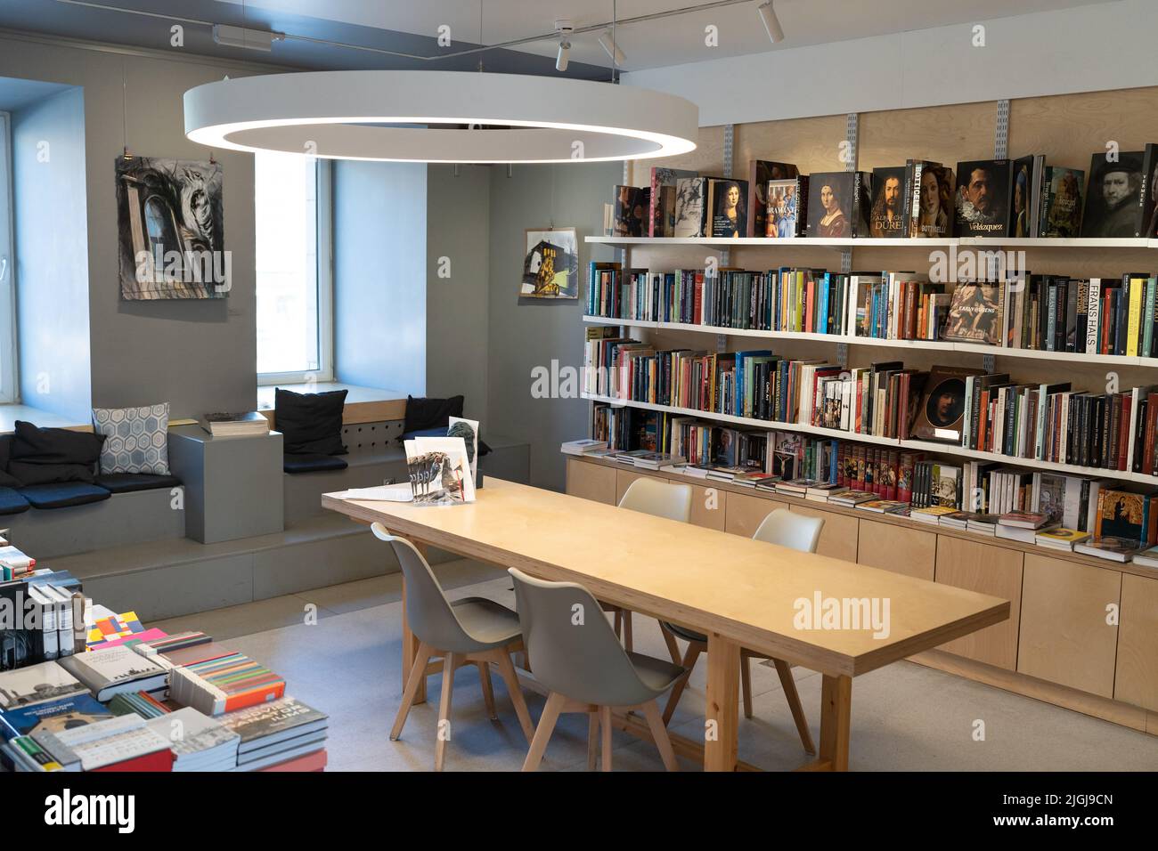 Co working space in library with a lot of books and modern interior ...