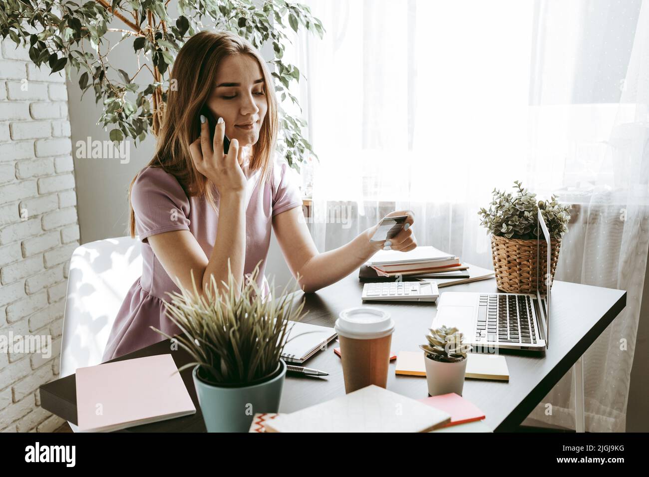 Young beautiful woman using mobile phone in modern office Stock Photo ...