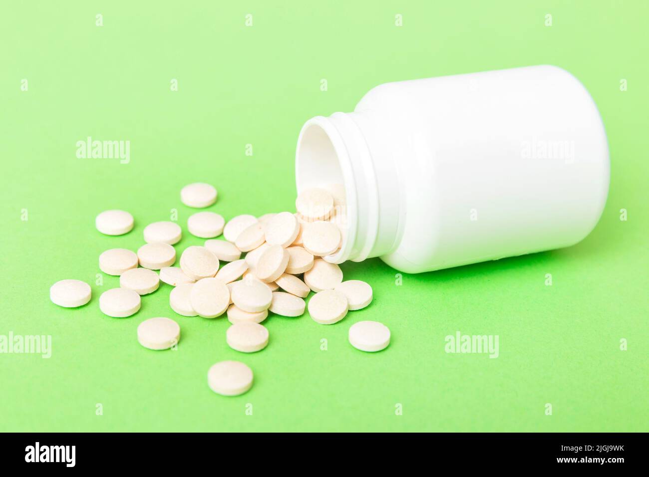 different drugs and health supplement pills poured from a medicine ...