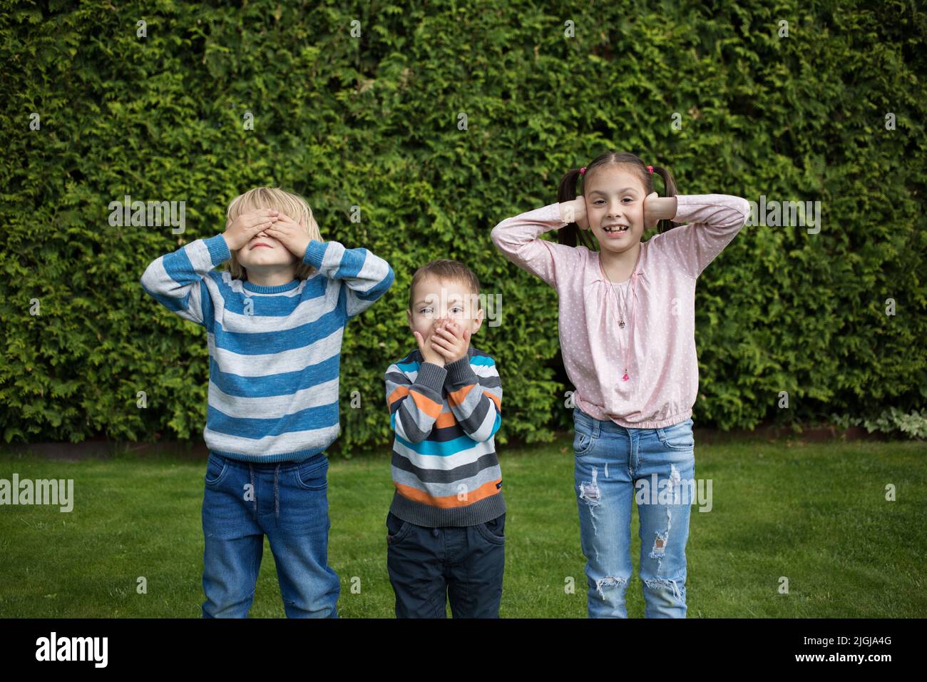 Three children visually show the concept - see nothing, say nothing and ...