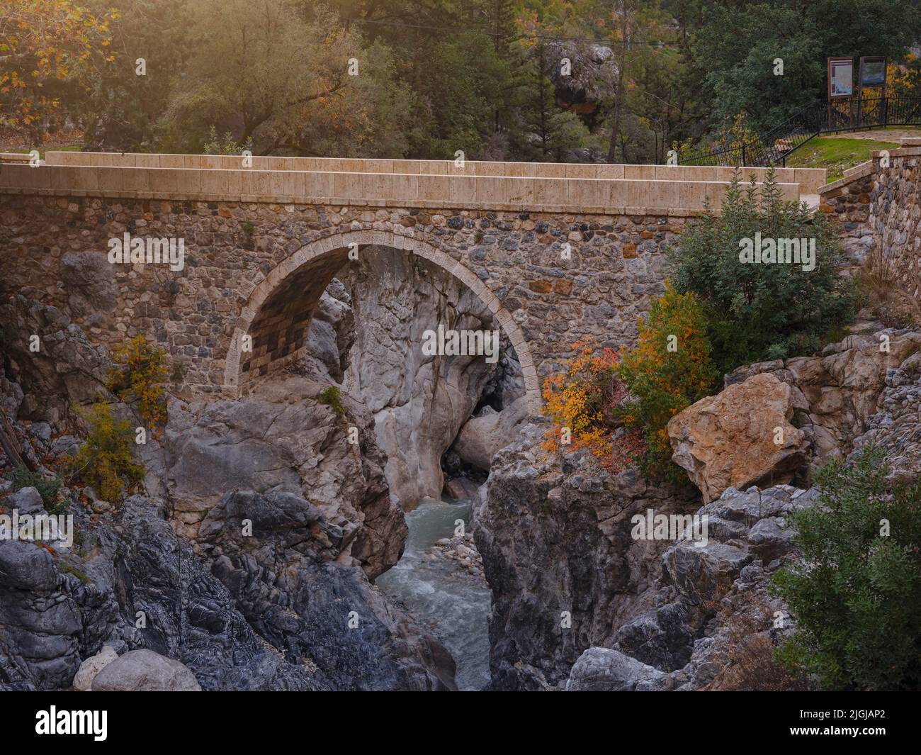 travel to Turkey, Kemer in autumn seasone. ancient Roman bridge over a ...