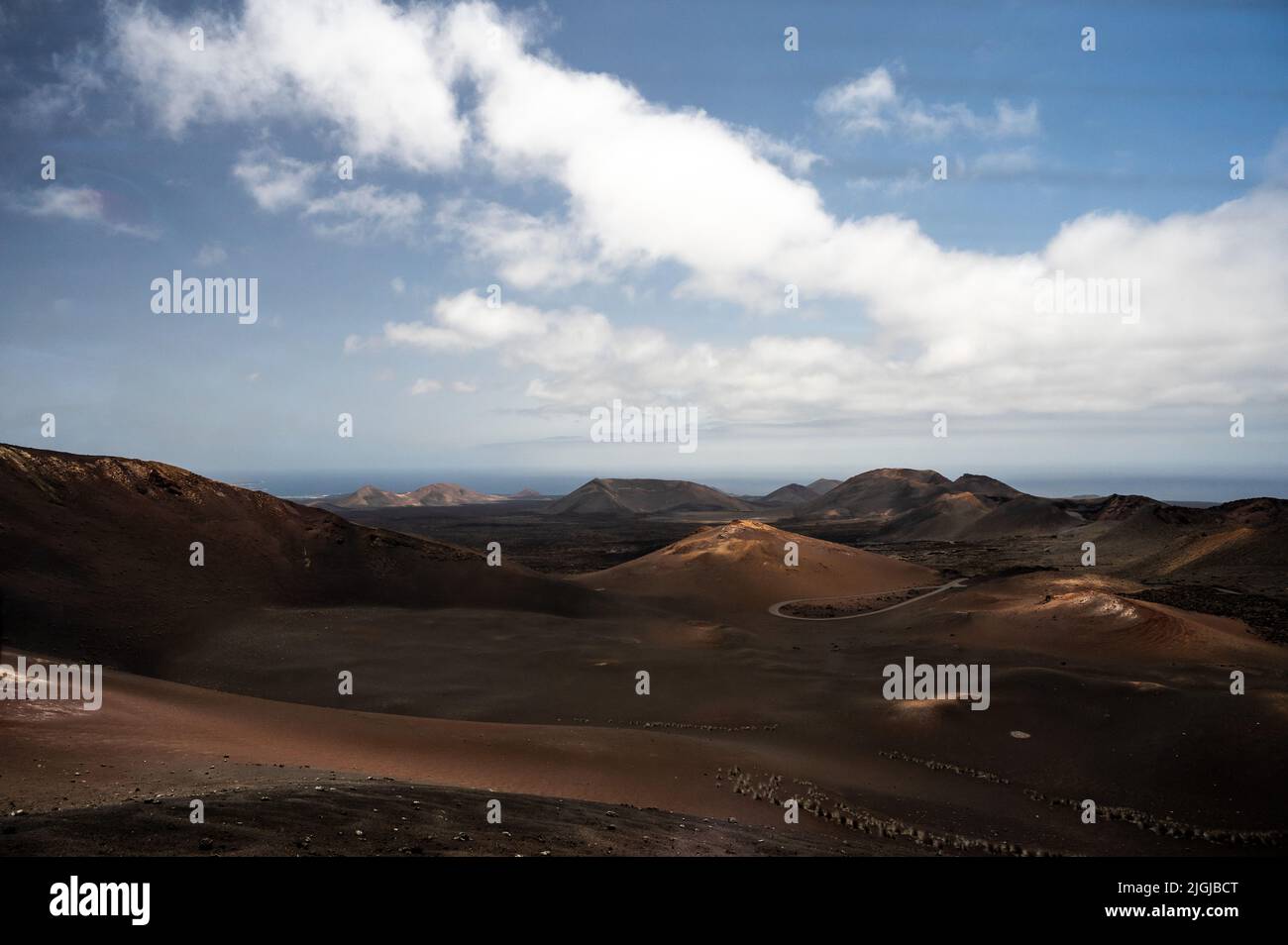 View of volcano craters in Timanfaya National Park, a protected ...