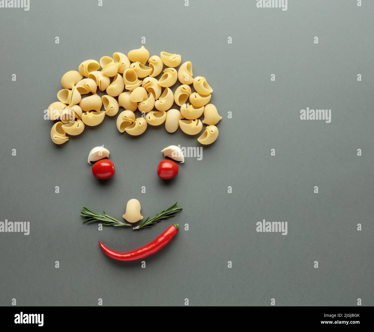 Funny portrait of a chef. Using ingredients for making pasta. Copy ...
