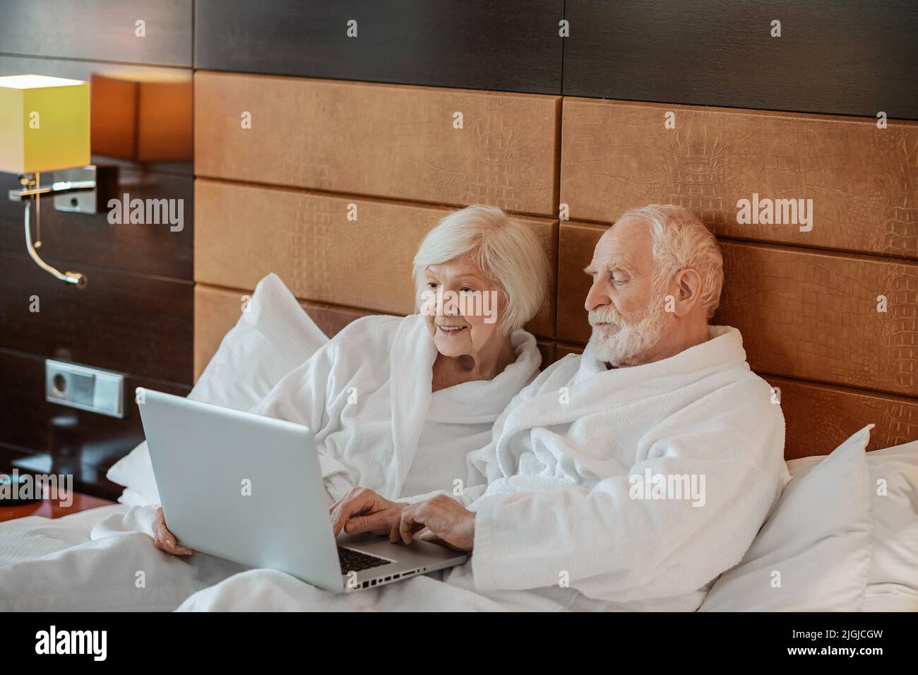 Man in bed watching something hi-res stock photography and images - Alamy
