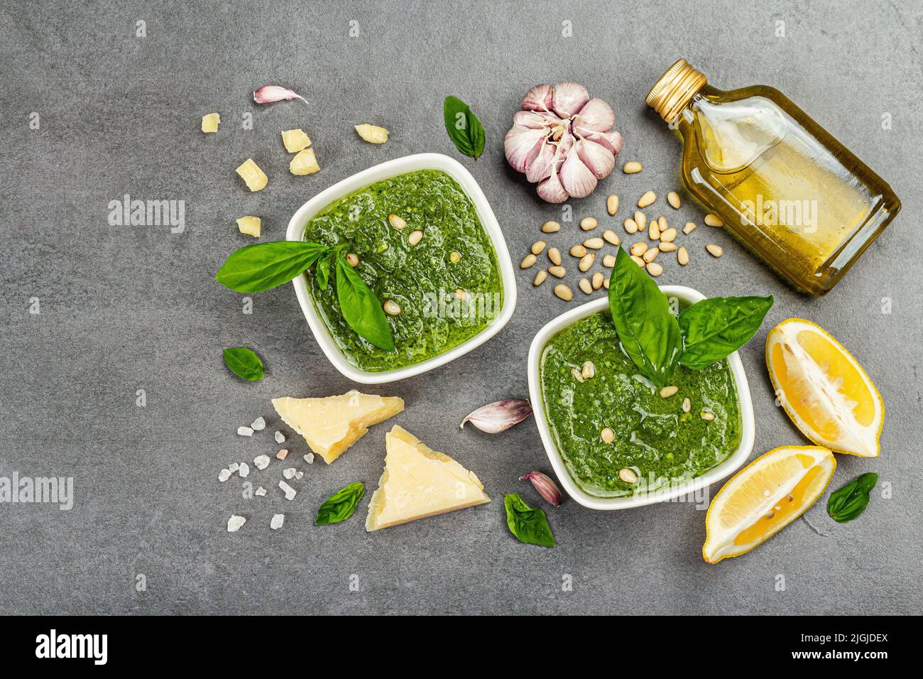 Pesto sauce in a bowls with pine nuts, parmesan and garlic. Traditional ...