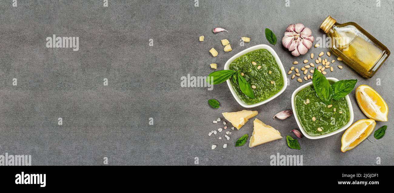 Pesto sauce in a bowls with pine nuts, parmesan and garlic. Traditional ...