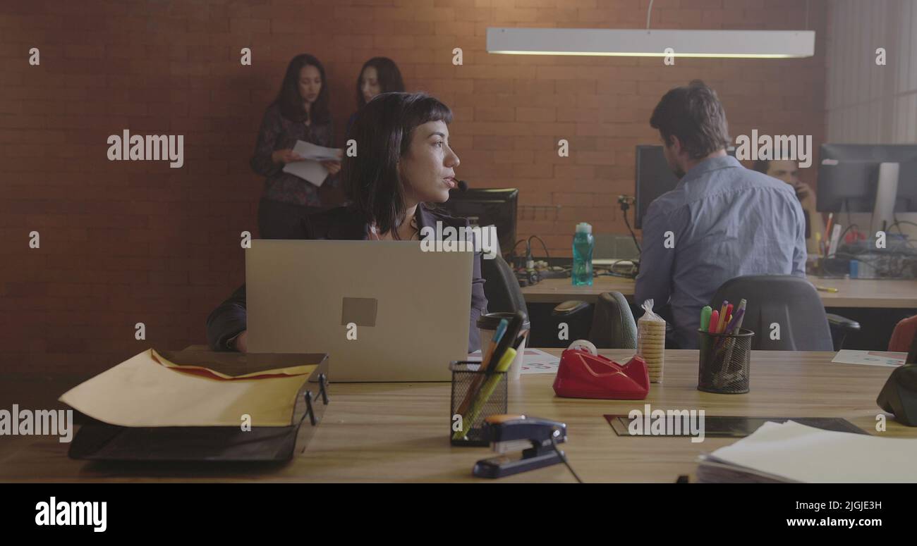 Group of young business people working at the office. Employees startup ...