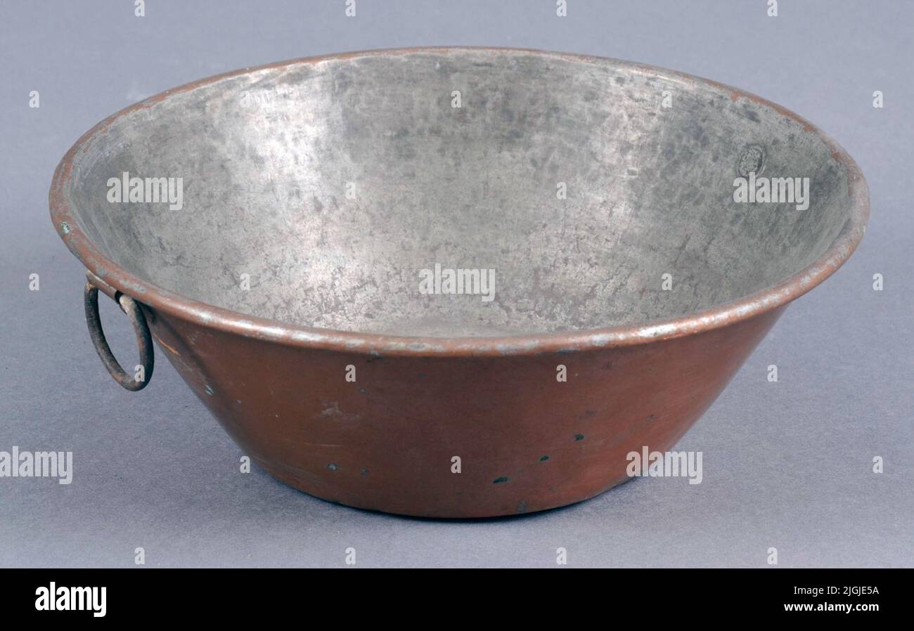 Bunke Bunke of copper with two ear rings. Inside down. Form as a ...