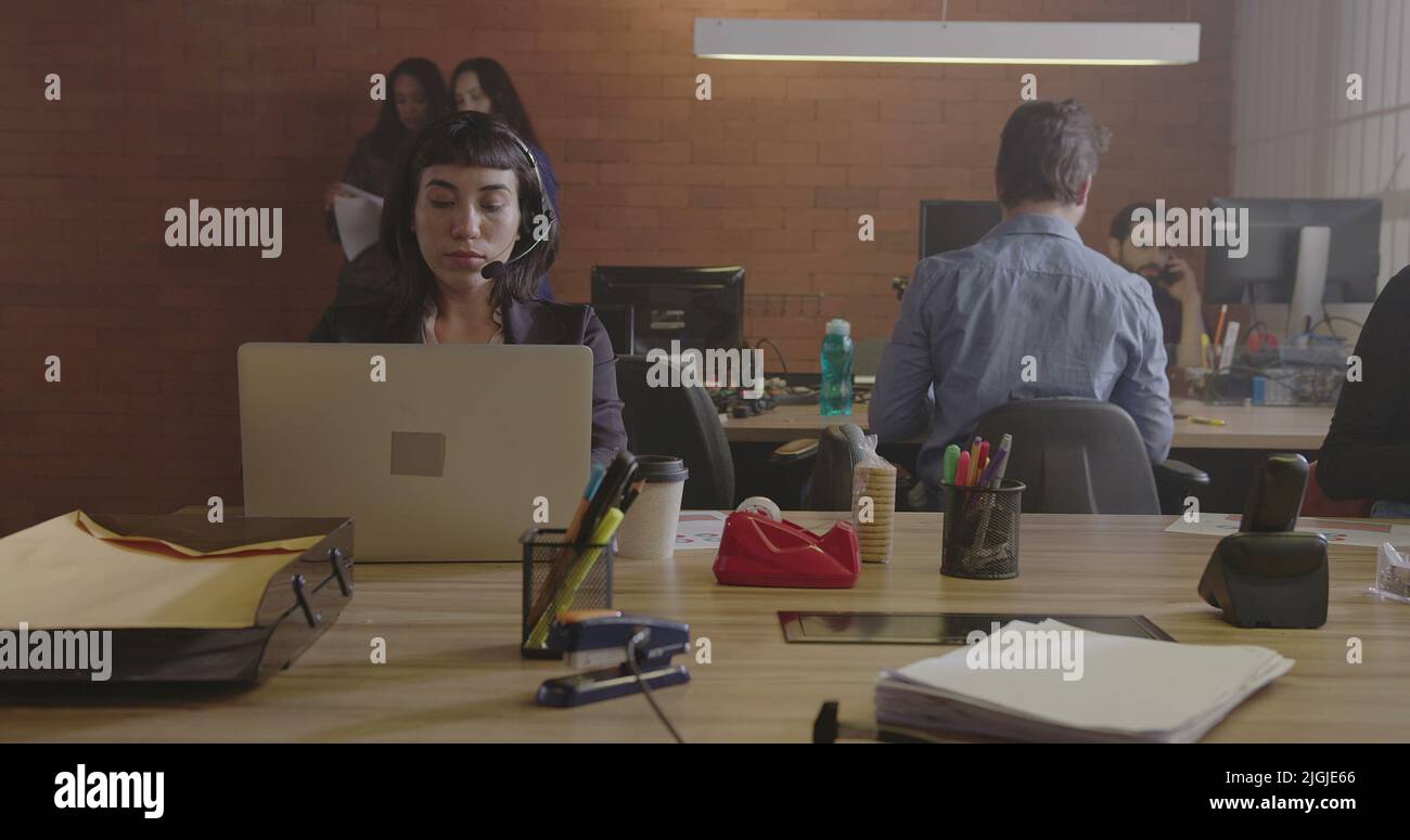 Group of young business people working at the office. Employees startup ...