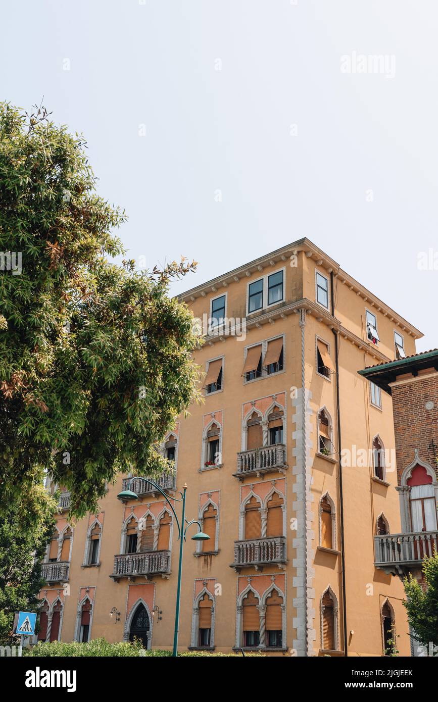 Low angle view on a traditional colourful residential building on Lido ...