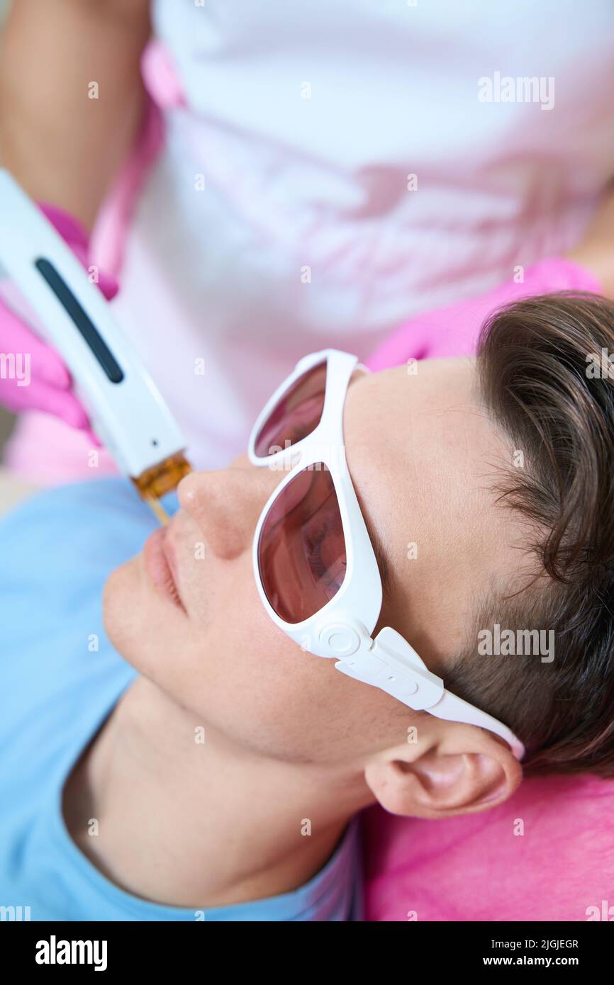 Man visiting beauty clinc for laser epilation Stock Photo - Alamy
