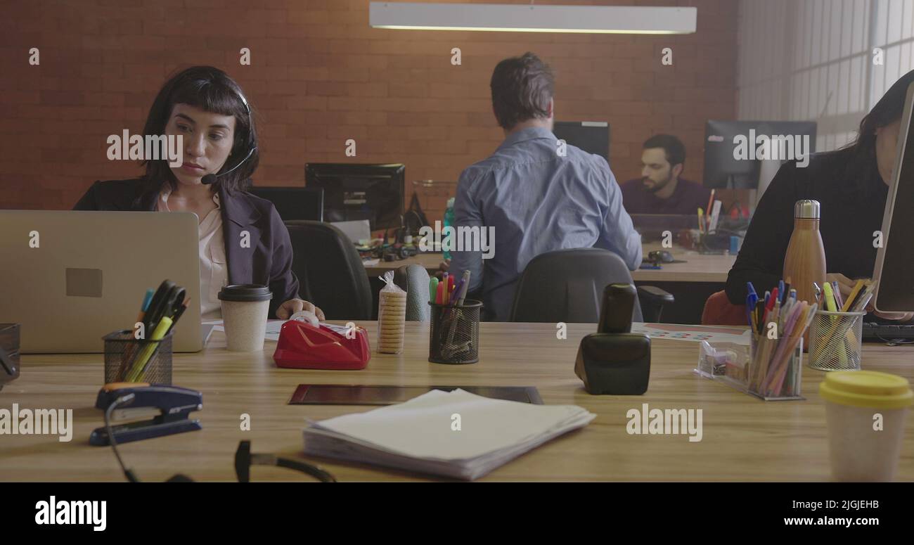 Group of young business people working at the office. Employees startup ...