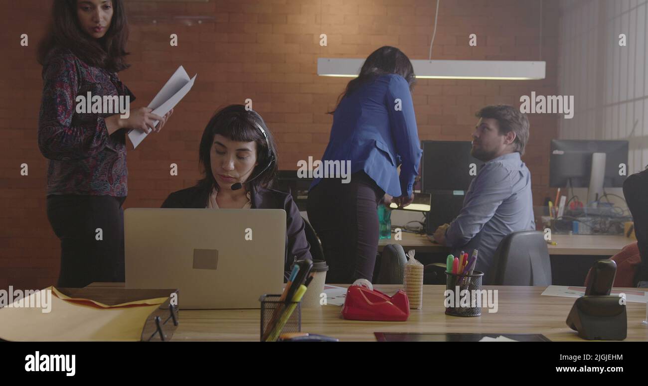 Group of young business people working at the office. Employees startup ...