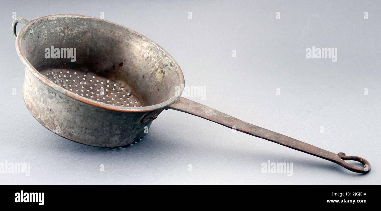 Durkslag Colander, of copper. Round, with long shaft of iron. Hake on ...