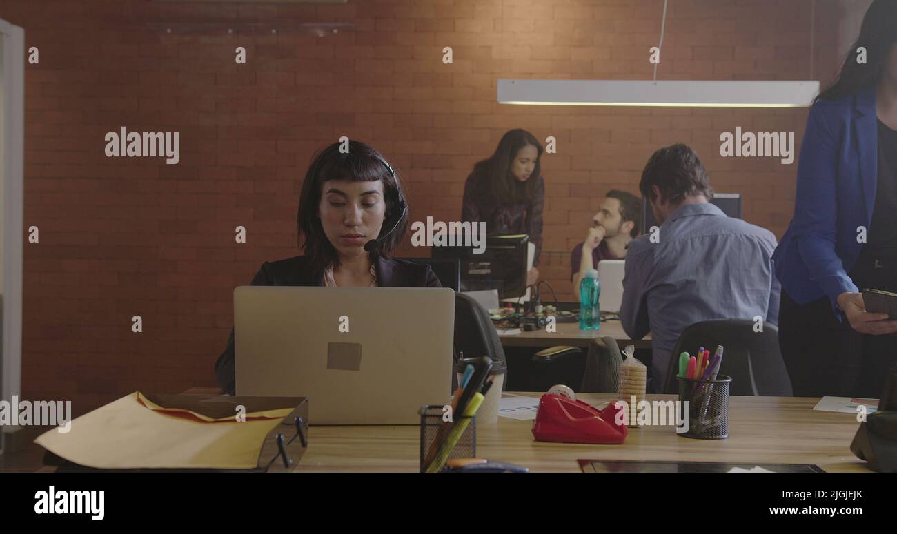 Group of young business people working at the office. Employees startup ...