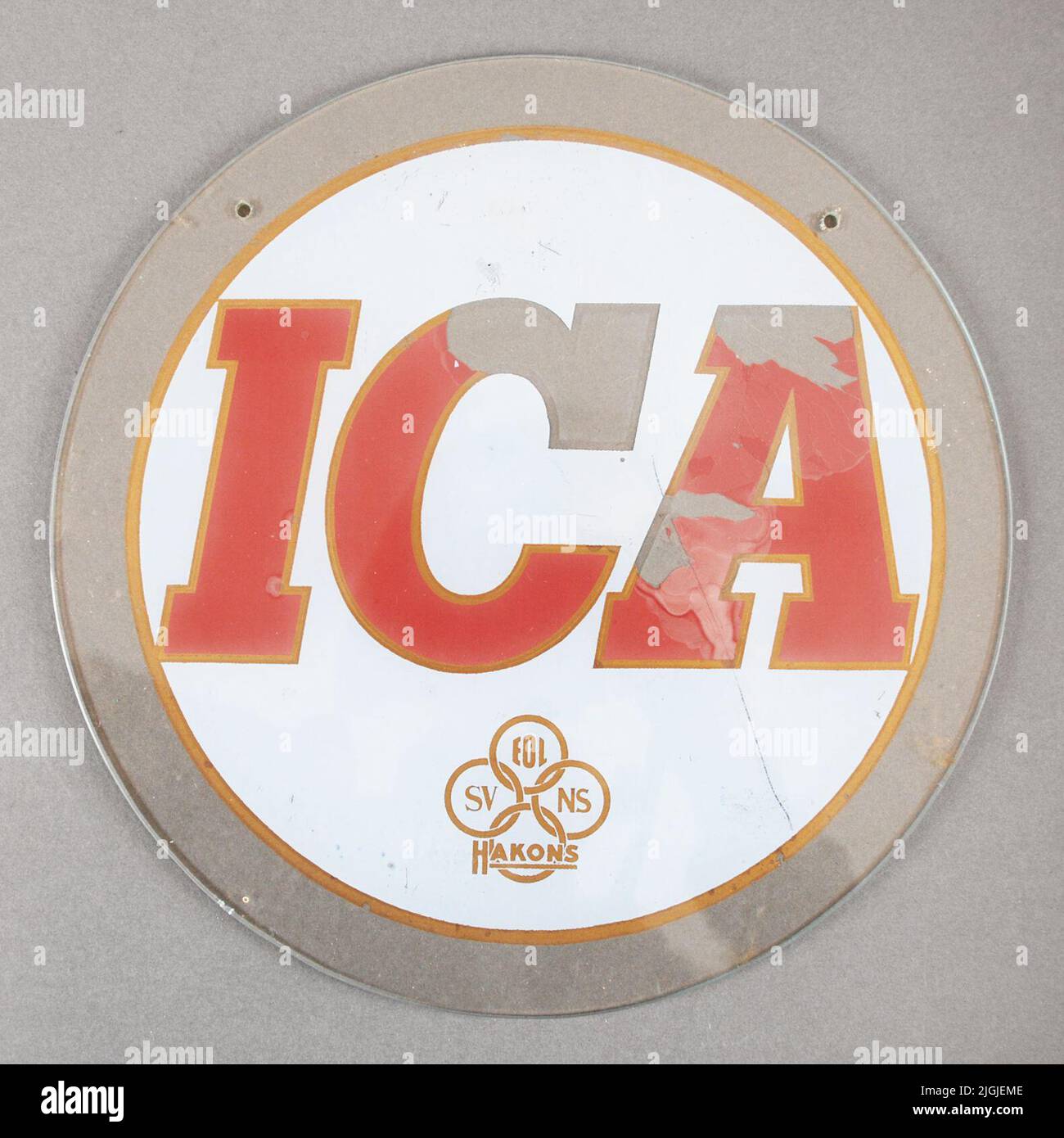 Skylt Store sign. Round glass plate. Text "Ica" in red on light blue ...