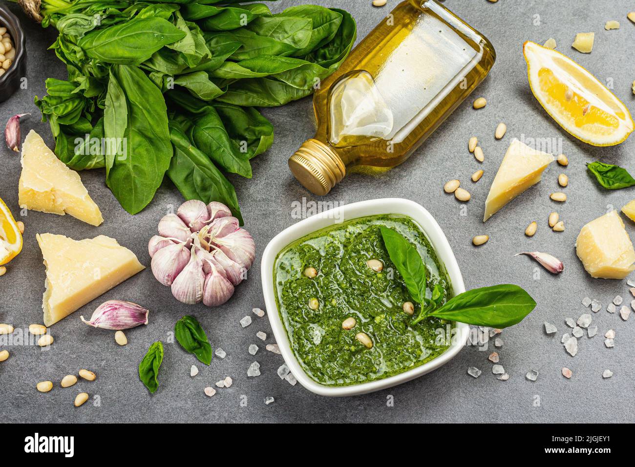 Pesto sauce in a bowls with pine nuts, parmesan and garlic. Traditional ...
