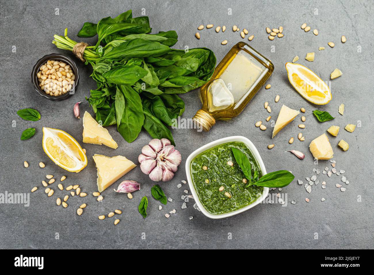 Pesto sauce in a bowls with pine nuts, parmesan and garlic. Traditional ...