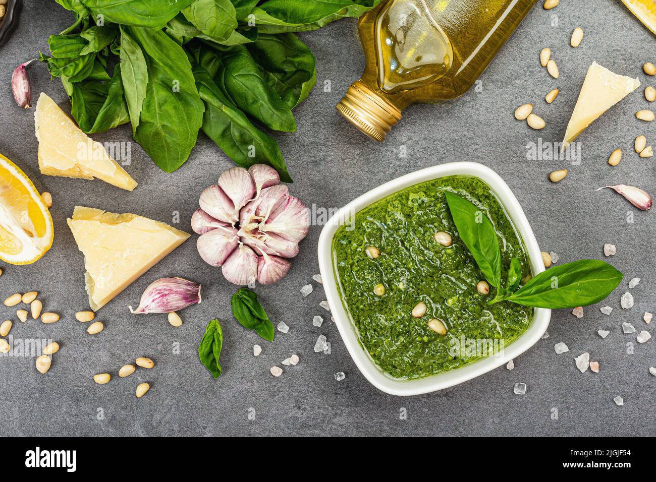Pesto sauce in a bowls with pine nuts, parmesan and garlic. Traditional ...