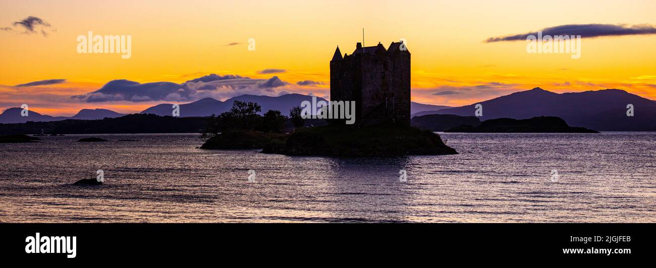 A beautiful sunset view of Castle Stalker in the Highlands of Scotland ...