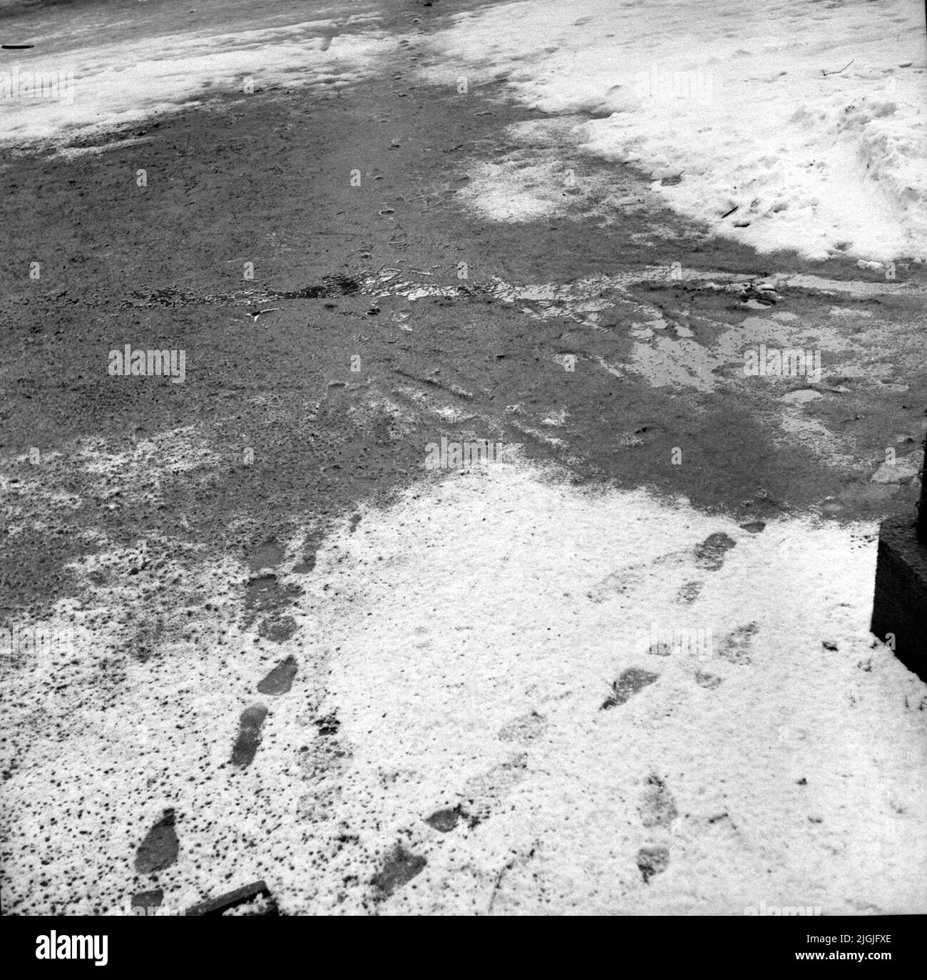 Footprints in clay and snow, unknown place Stock Photo - Alamy