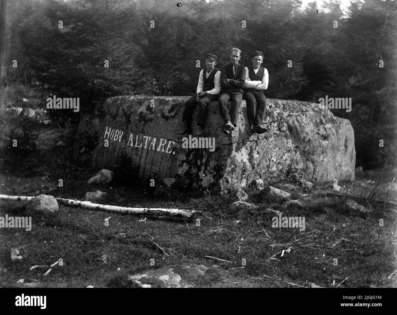 Three young men on the stone Hoby Altare, Bräkne-Hoby Stock Photo - Alamy