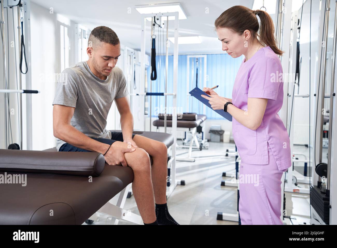 Man having appointment with doctor in rehabilitation clinic Stock Photo - Alamy