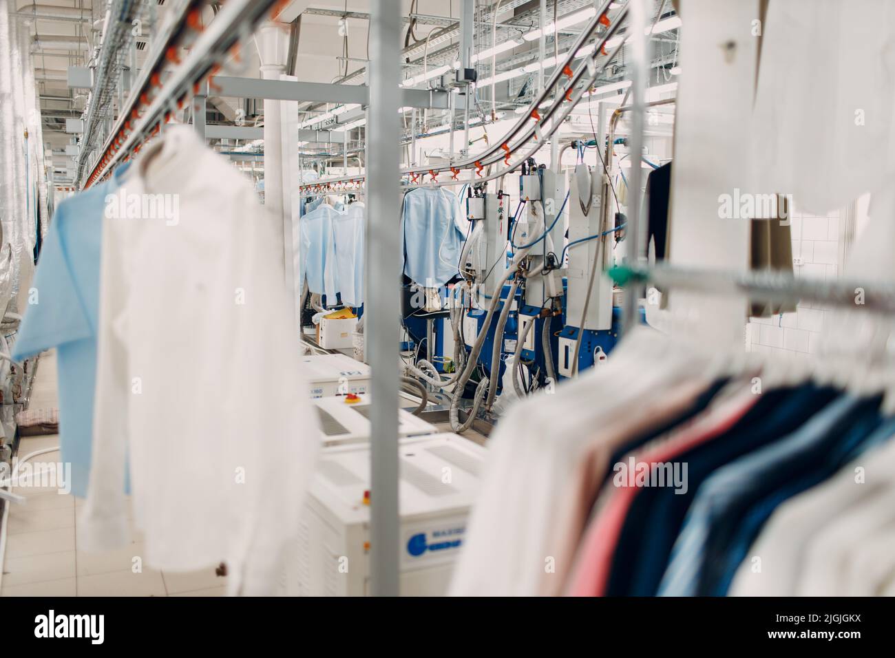 Dry cleaning clothes. Clean cloth chemical process. Laundry industrial ...