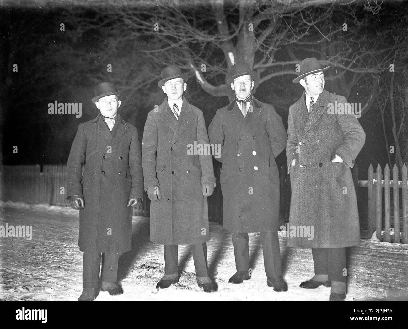 Four men posing Black and White Stock Photos & Images - Alamy