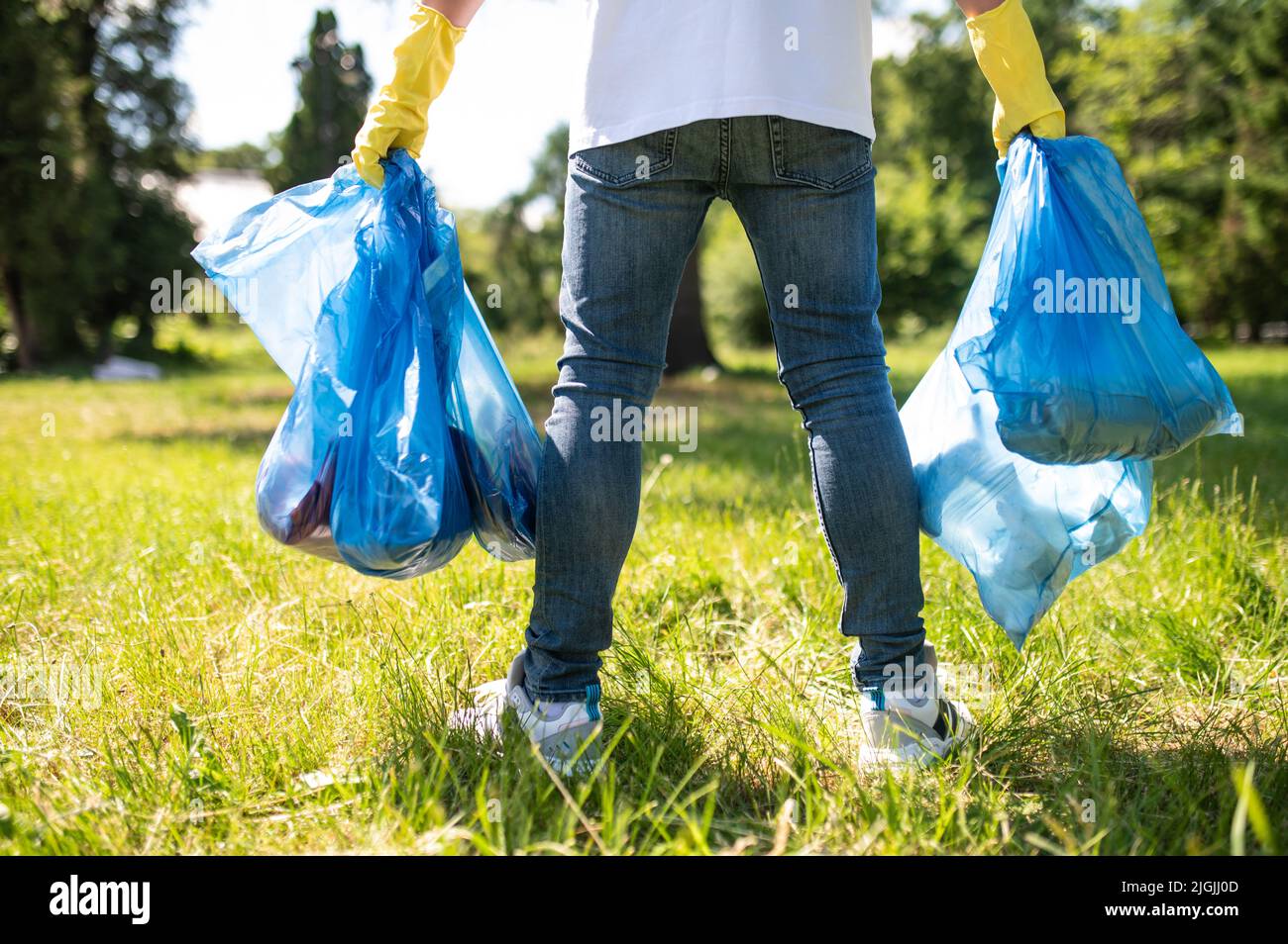 Person with bags hi-res stock photography and images - Alamy