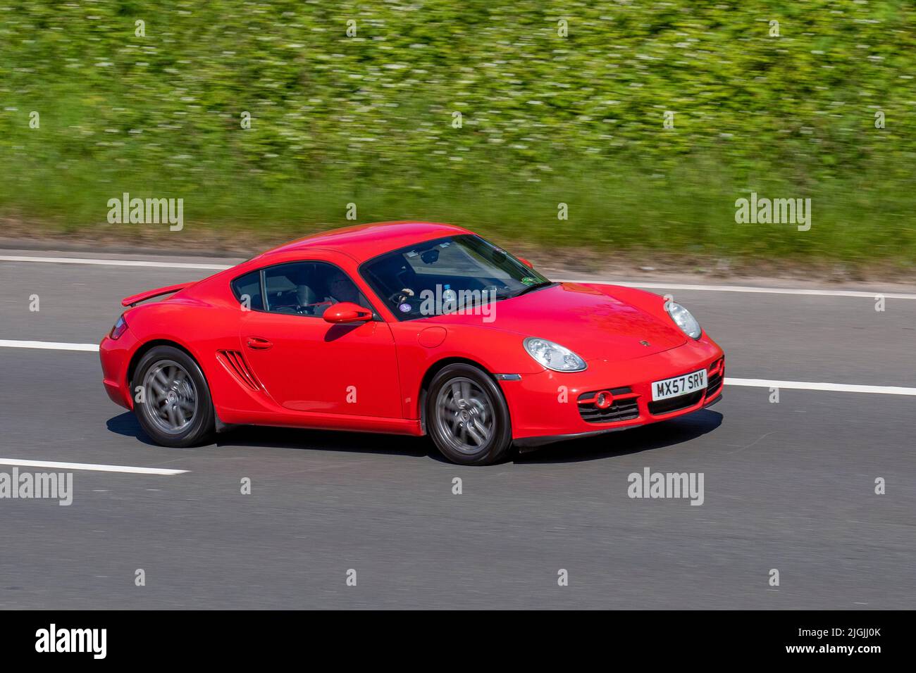 2008 red Porsche Cayman 2687cc petrol Coupe; travelling on the M61 ...