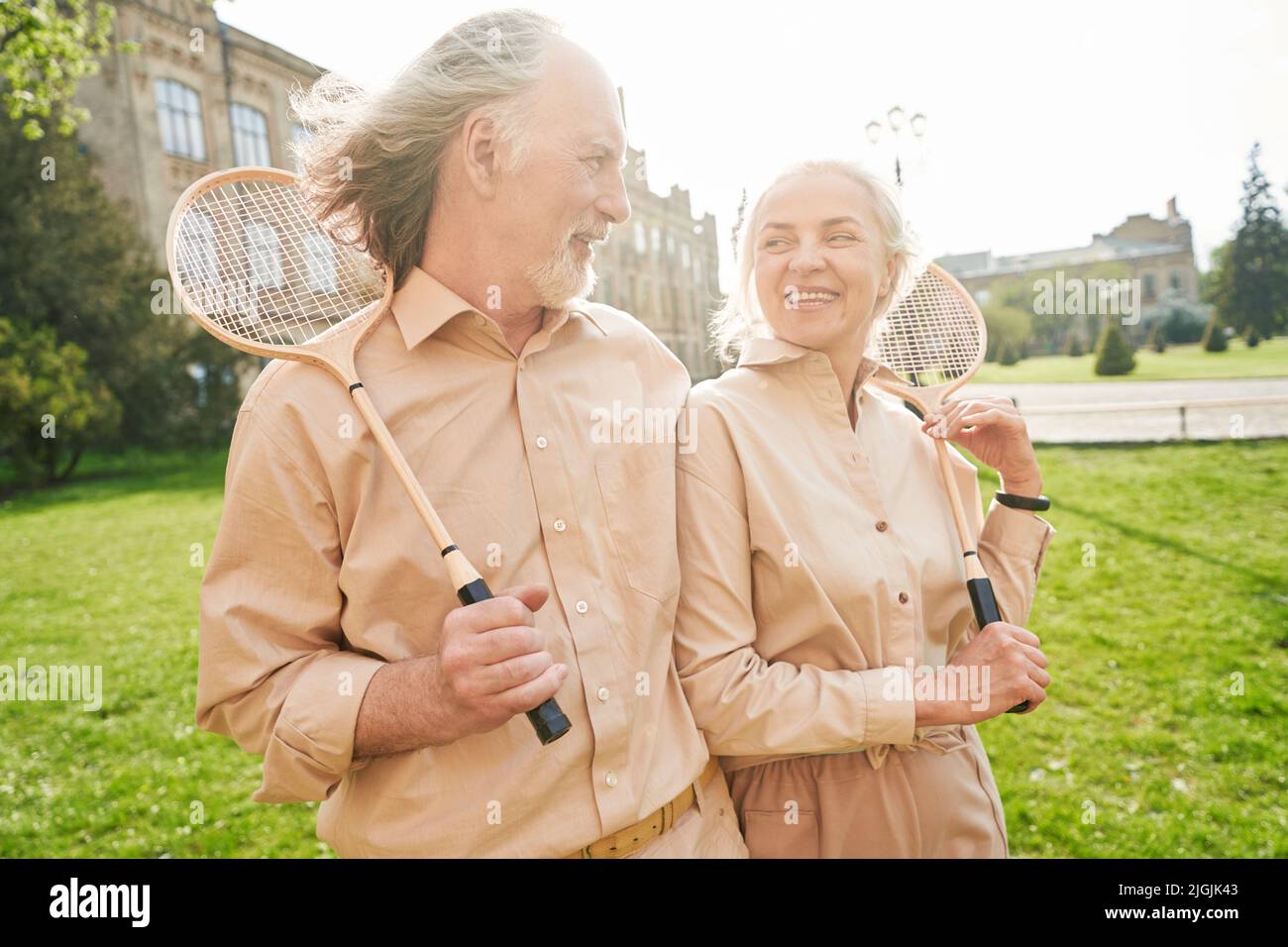 Two happy people having active weekend in the park Stock Photo - Alamy