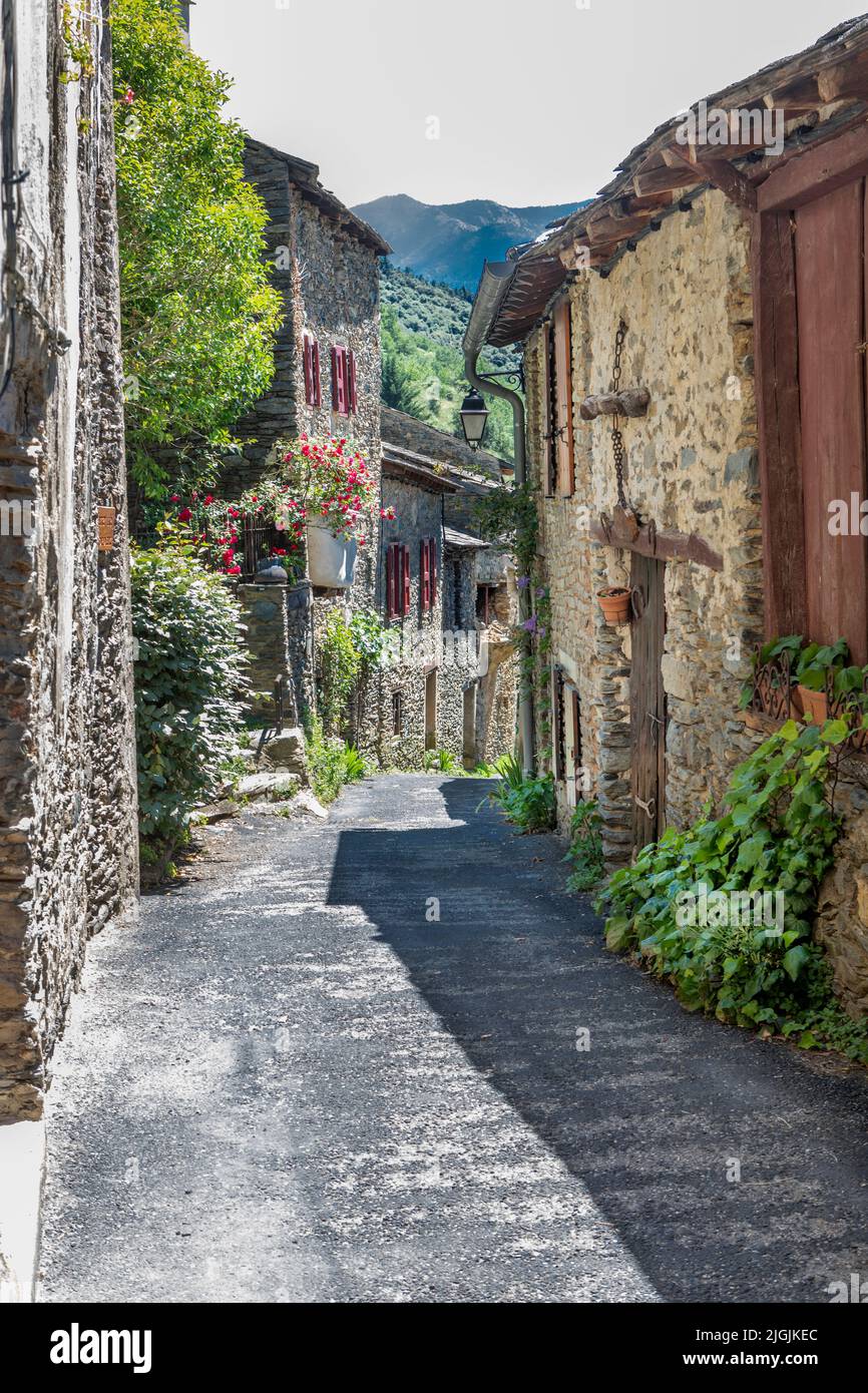 An old narrow street in Evol, Pyrenees Orientales, France Stock Photo ...