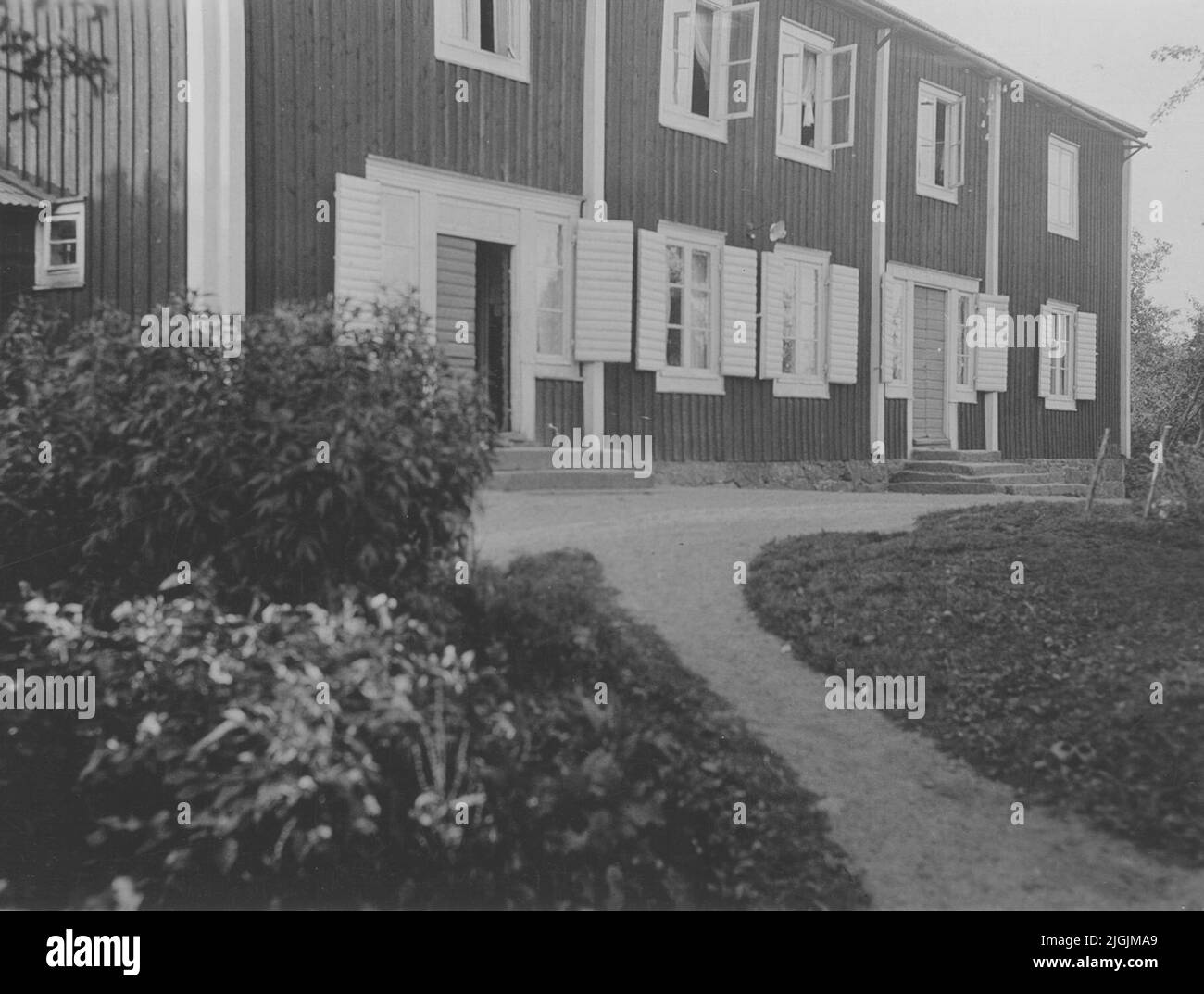 Bostad Two -storey residential building with white painted shutters in ...