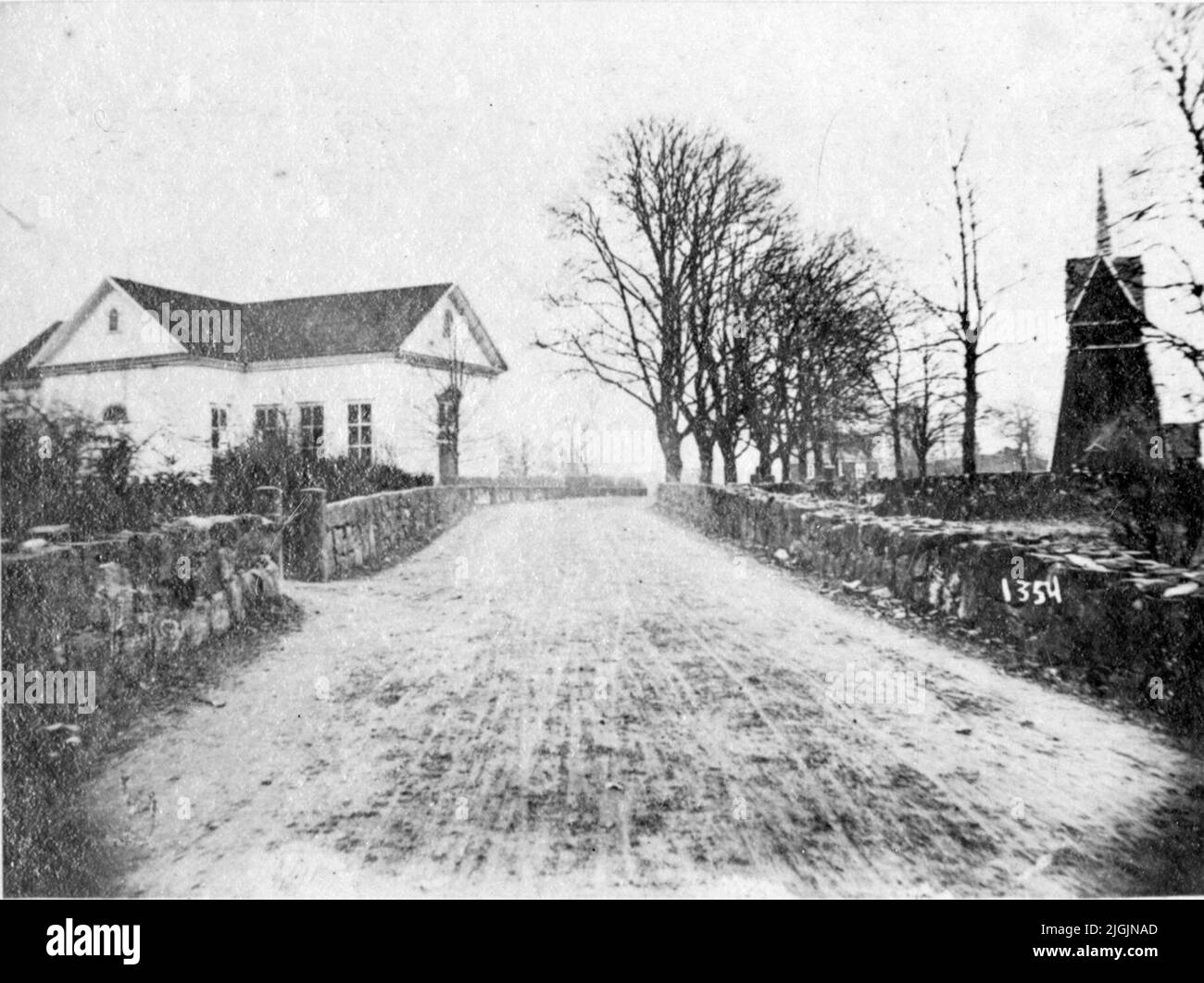 The road through Backaryd with the church on the left and the belfry to ...