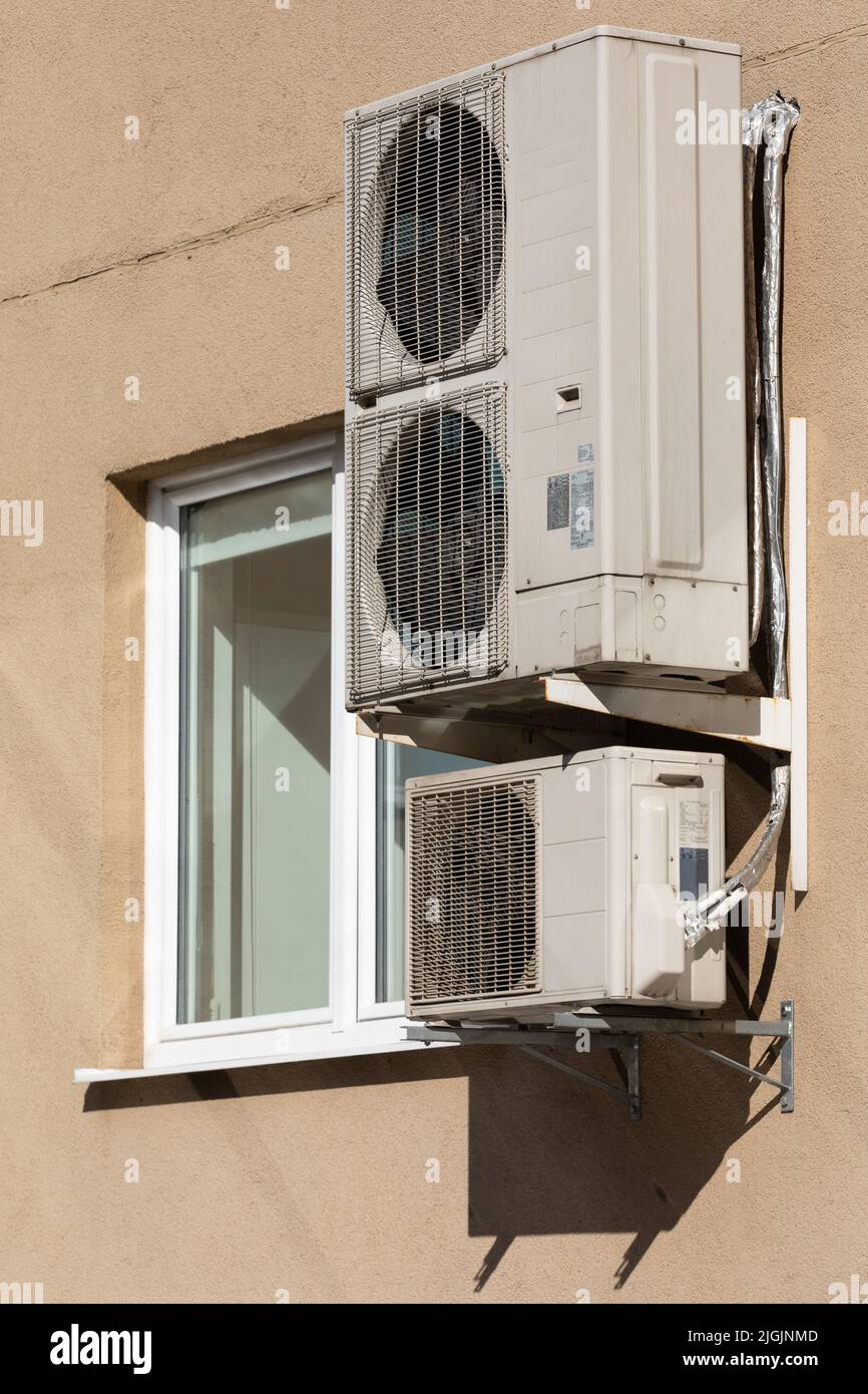 air conditioning unit Central split system hanging outside the building ...