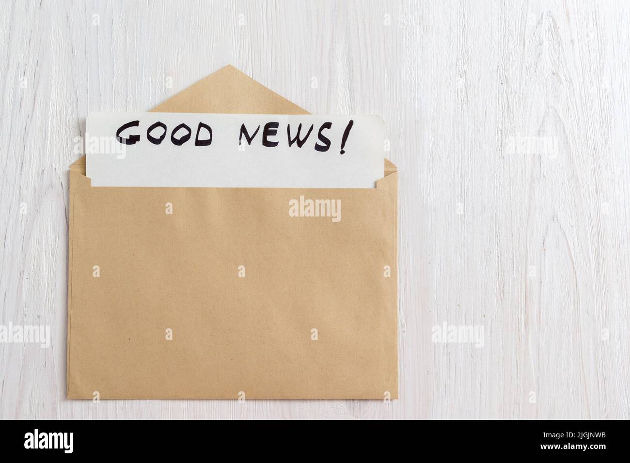 Opened yellow envelope with paper letter inside Stock Photo - Alamy