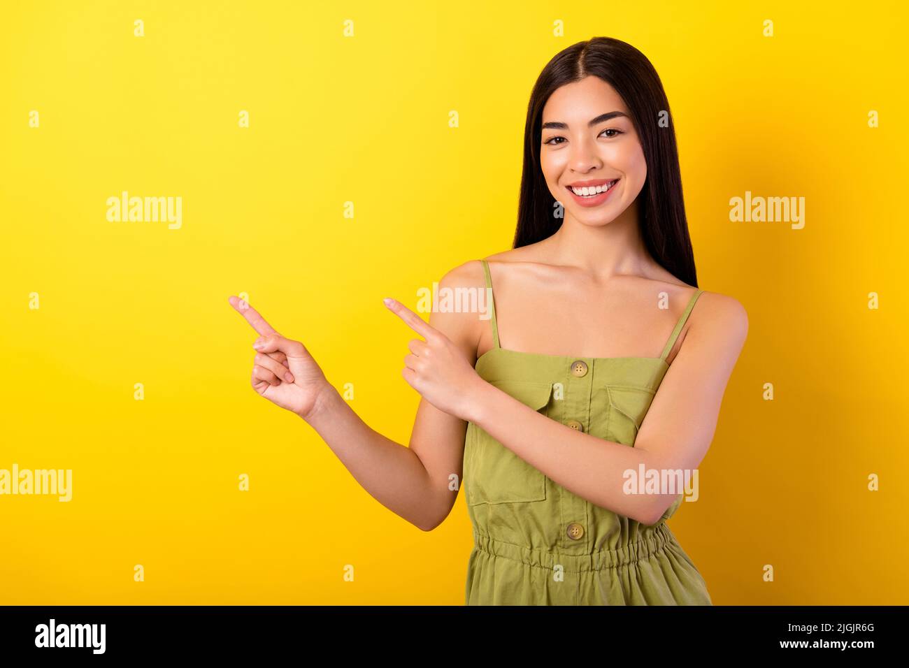 Portrait of cheerful adorable filipino girl toothy smile direct fingers ...