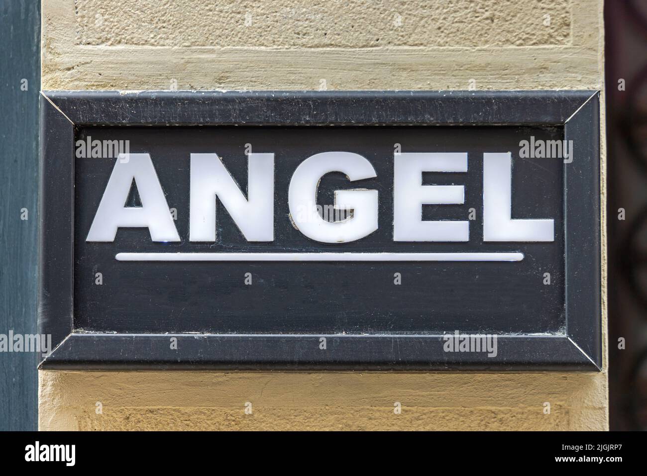 Illuminated White Sign Angel in Black Frame Stock Photo - Alamy