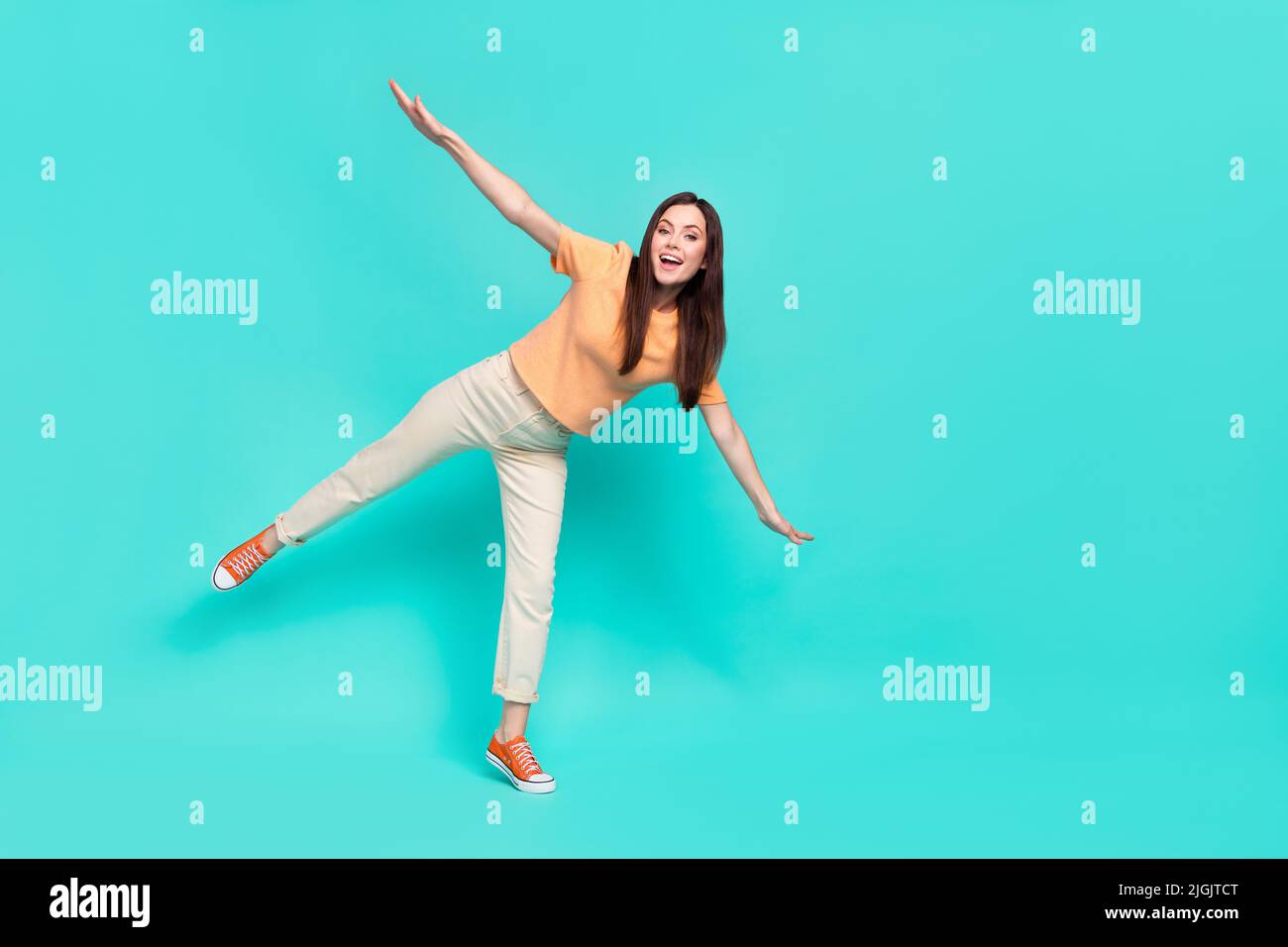 Full body portrait of satisfied overjoyed lady raise hands up flying ...