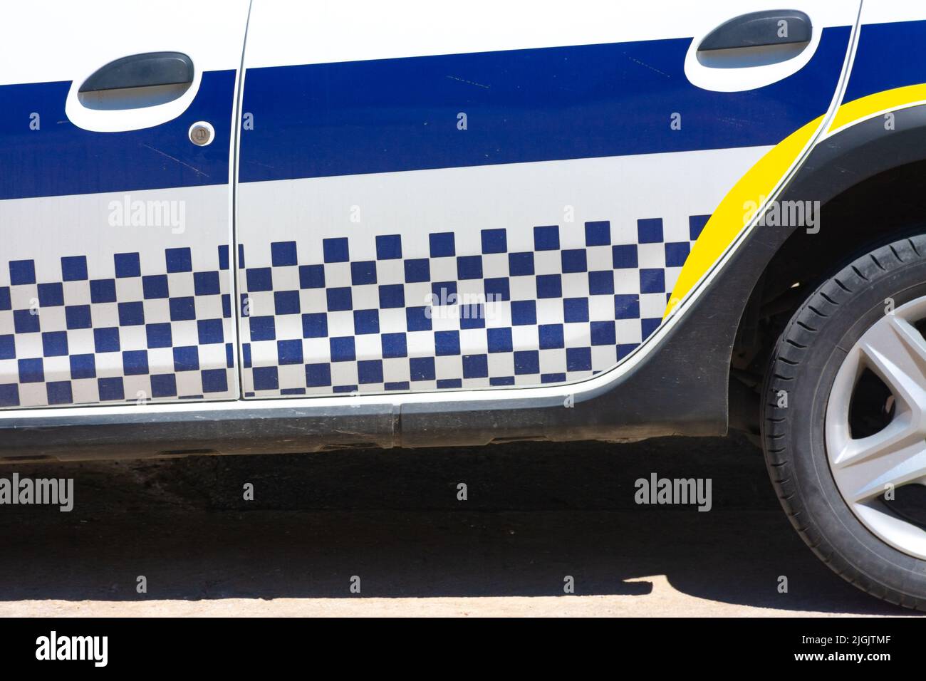 Detail of the decal with white and blue squares on the lower side of a ...
