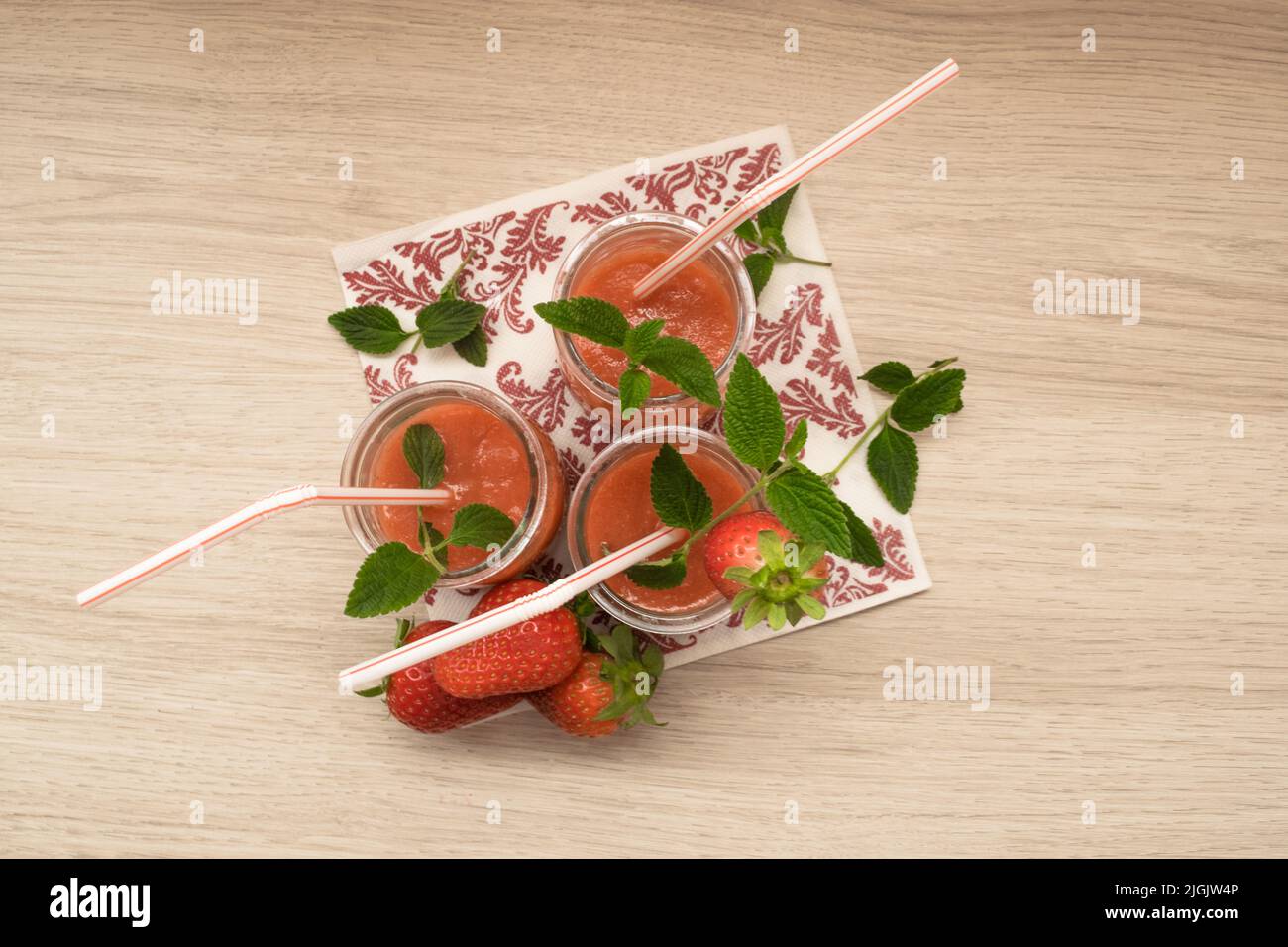 top view of several strawberry milkshakes with wooden background Stock ...