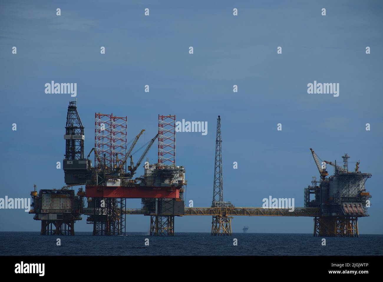 Oil rig in gray evening sky offshore at Ekofisk, North sea Stock Photo ...