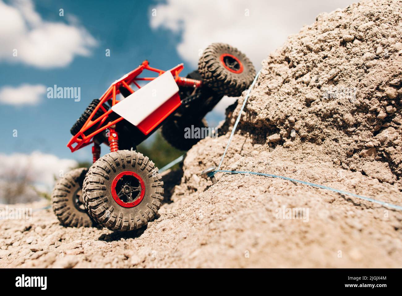 Suv overcoming rock rise, close-up Stock Photo - Alamy