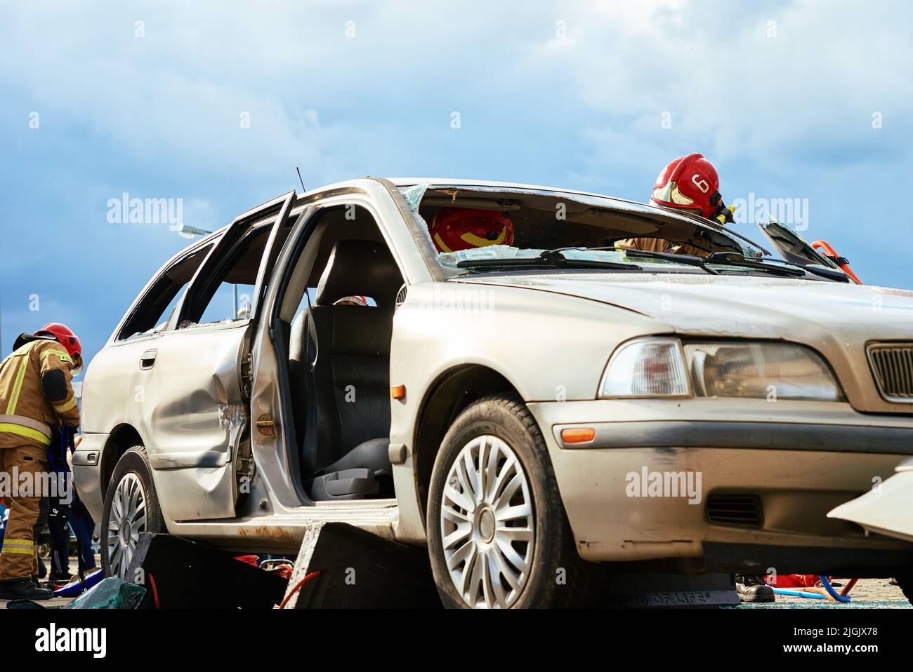 Firefighters during a rescue operation training. Rescuers unlock the ...