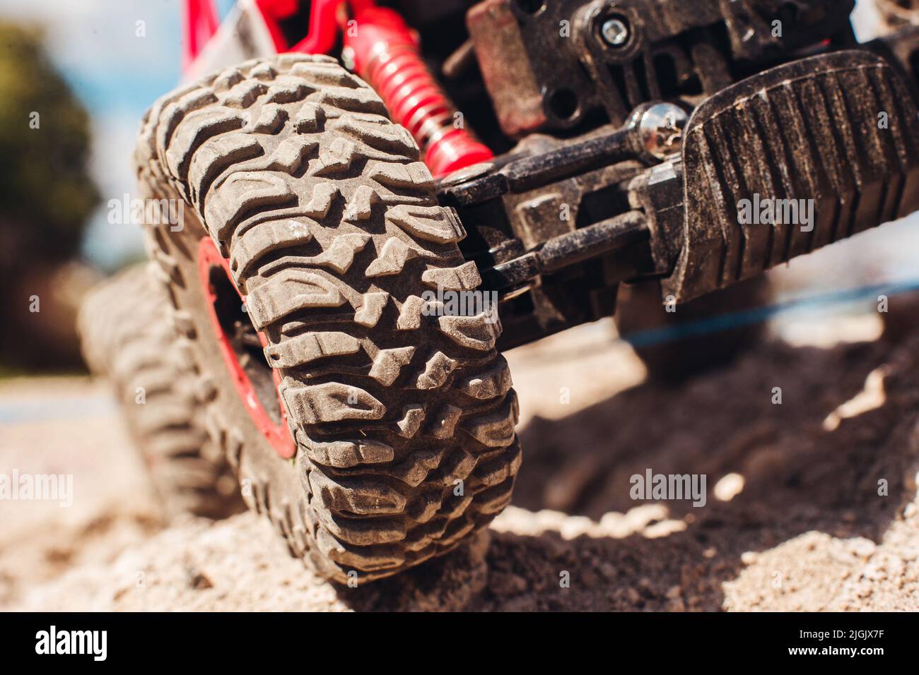 Wheels of off road car on rock landscape, close-up Stock Photo - Alamy