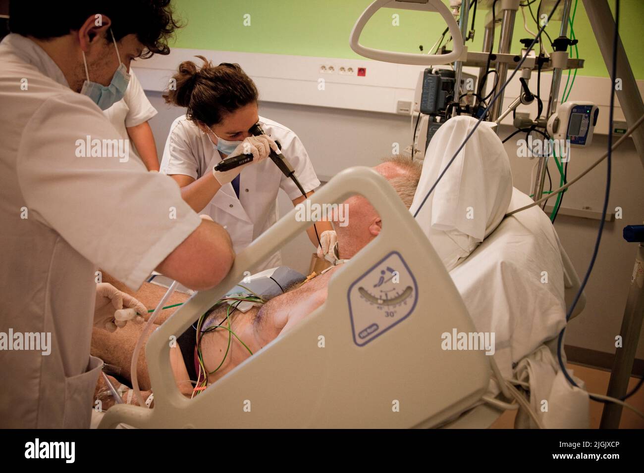 Doctors oscultate through the trachea a patient with Charcot s disease ...