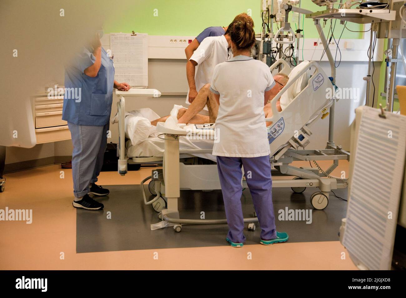 Doctors oscultate through the trachea a patient with Charcot s disease ...